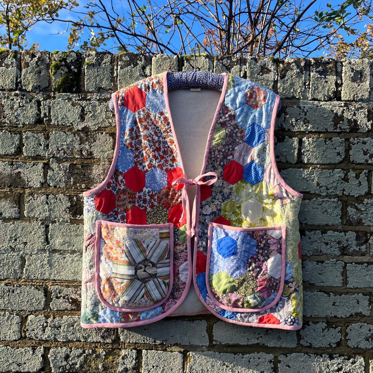 Hand-pieced recycled patchwork quilt vest waistcoat – a circular story